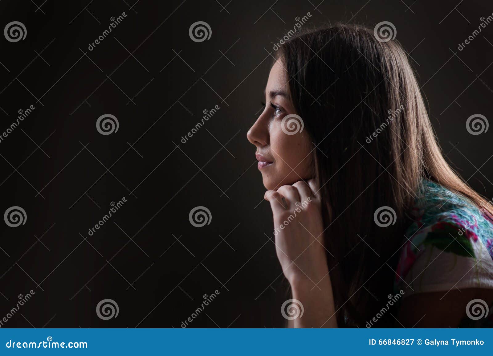 Beautiful Woman Looking into the Distance on a Dark Background Stock ...
