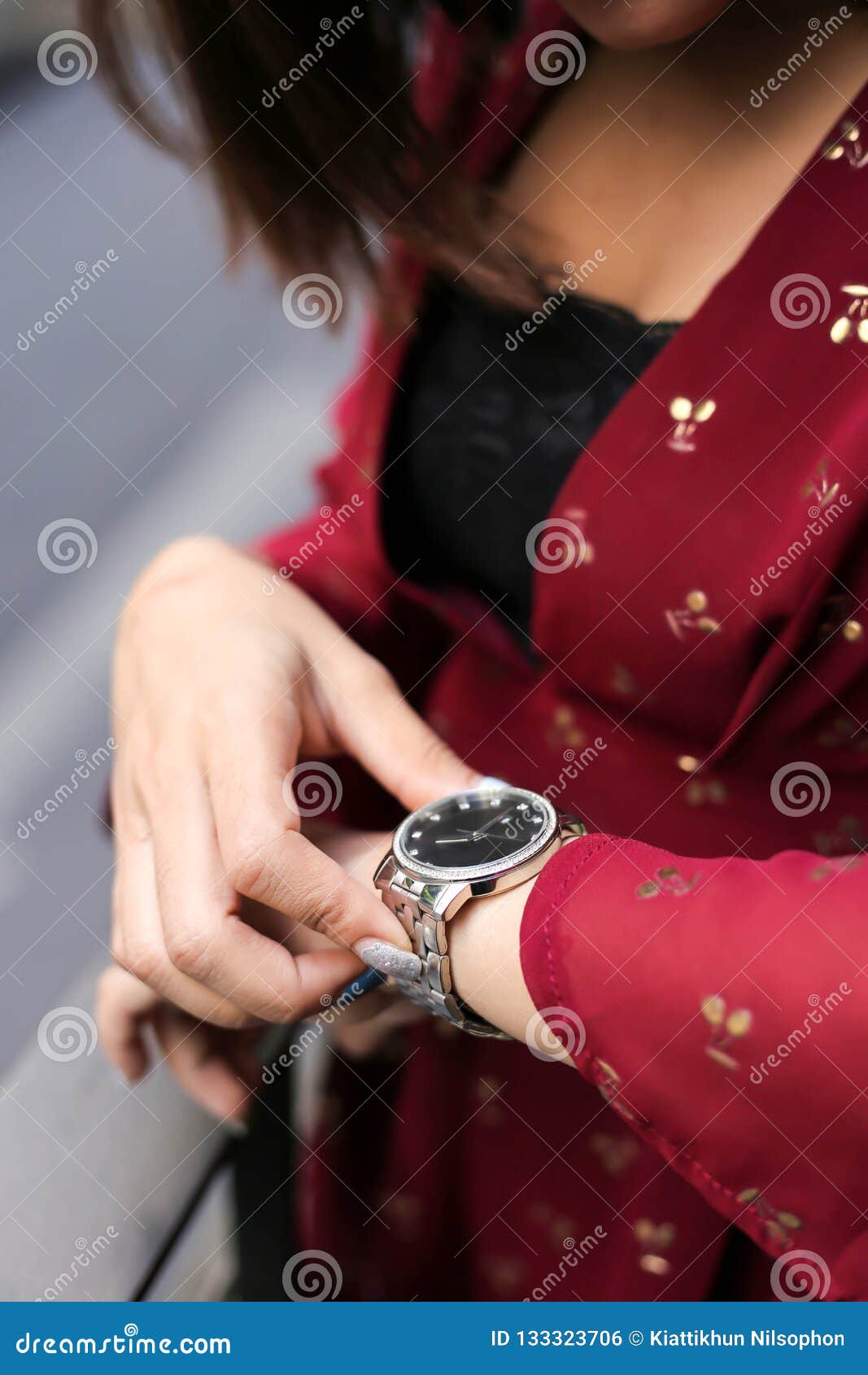 Beautiful Woman Looking at Her Watch Stock Photo - Image of beautiful ...