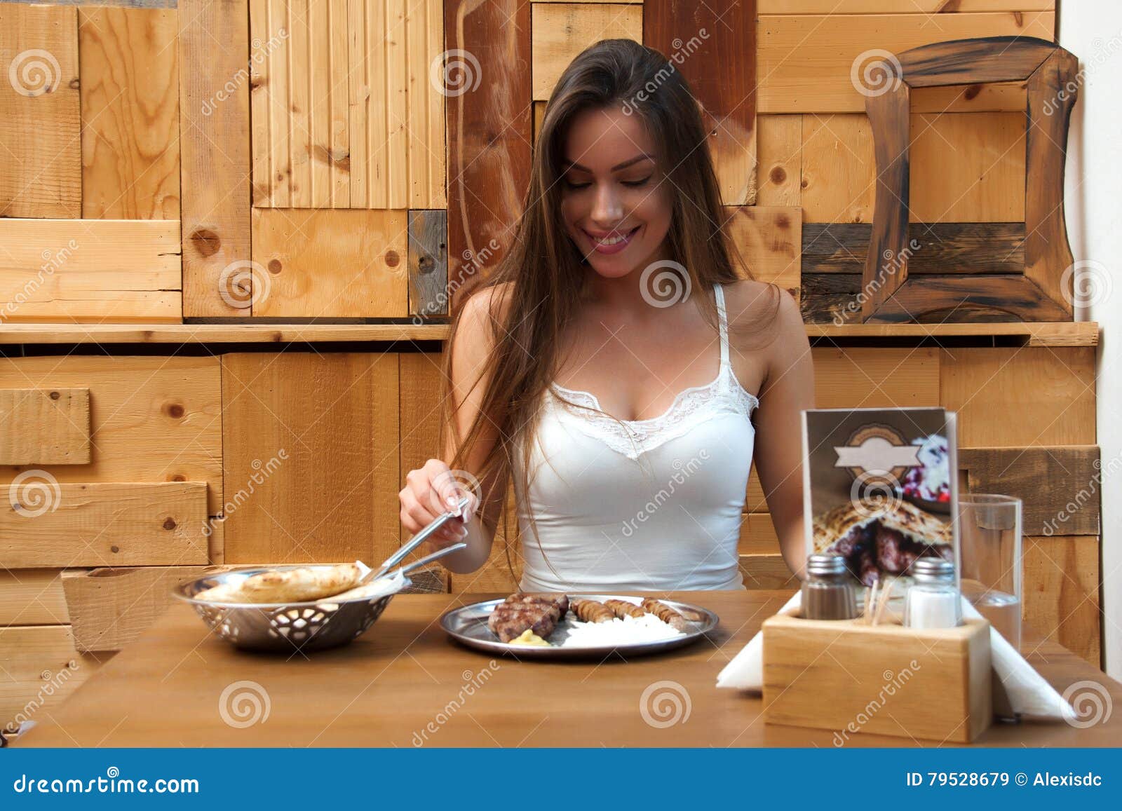 Beautiful woman at lunch stock image. Image of onion - 79528679