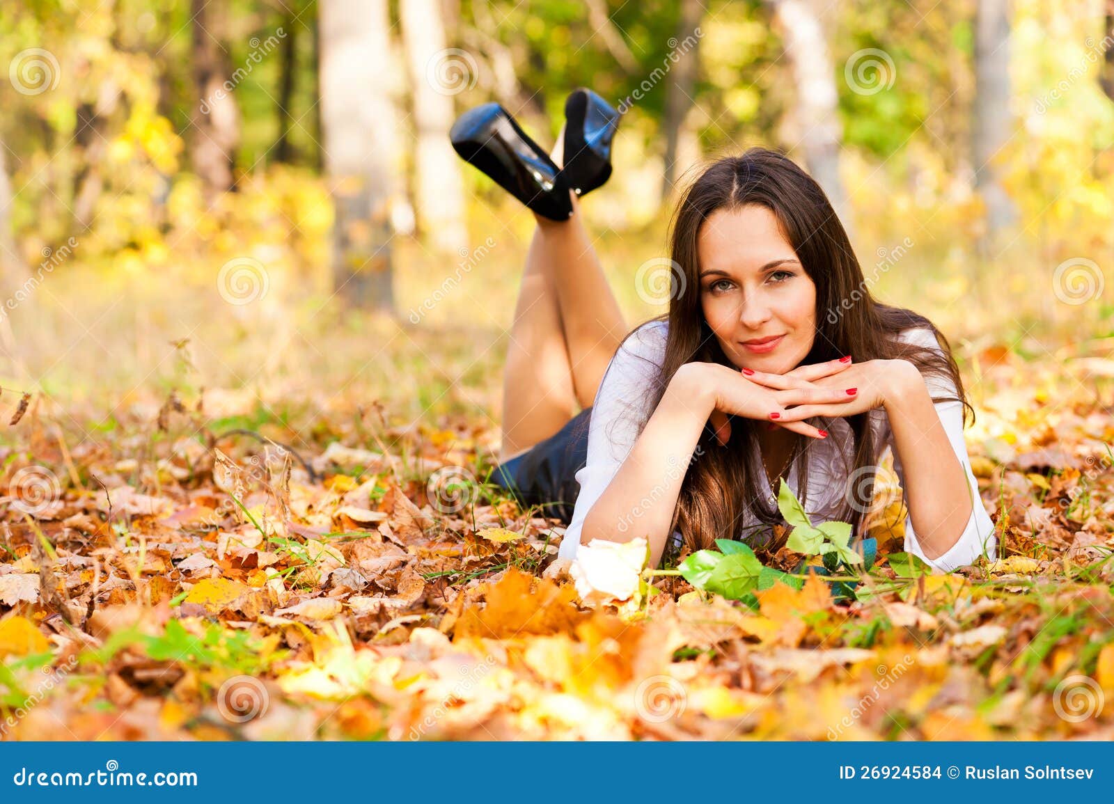 Beautiful woman lying stock photo. Image of woman, leaves - 26924584
