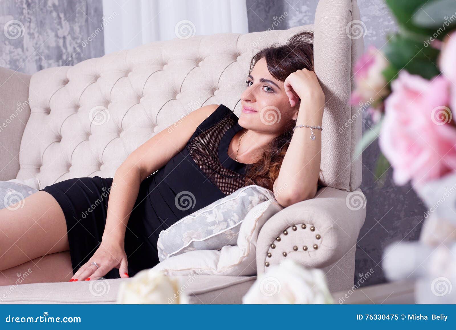 The Beautiful Woman Lying on Leather Sofa Stock Image - Image of ...