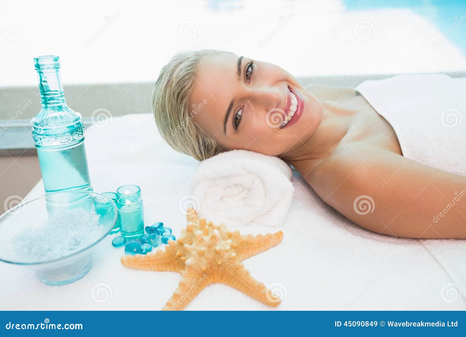 Beautiful Woman Lying On Massage Table At Spa Center Stock Image