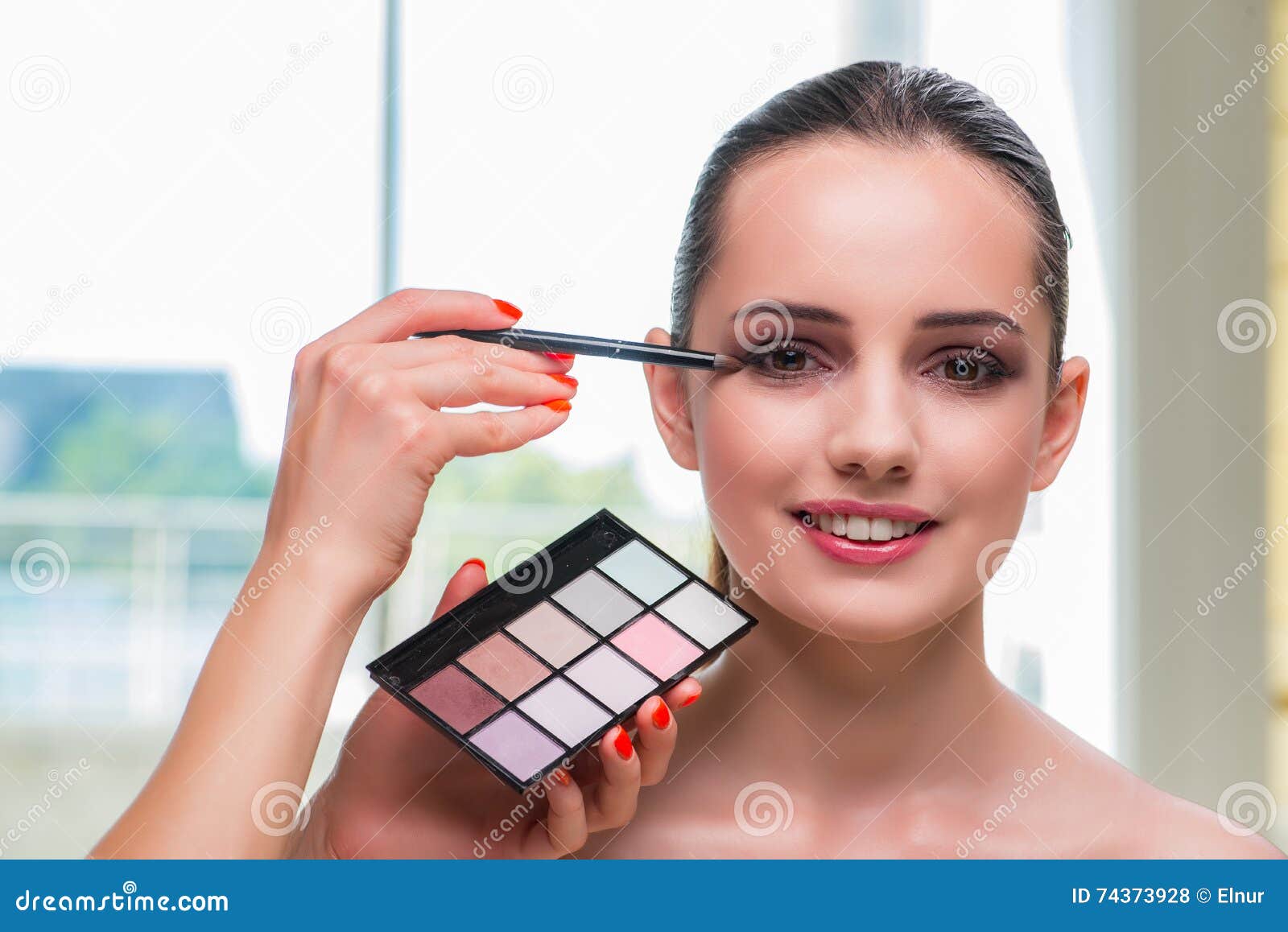 The Beautiful Woman during Make-up Cosmetics Session Stock Photo ...