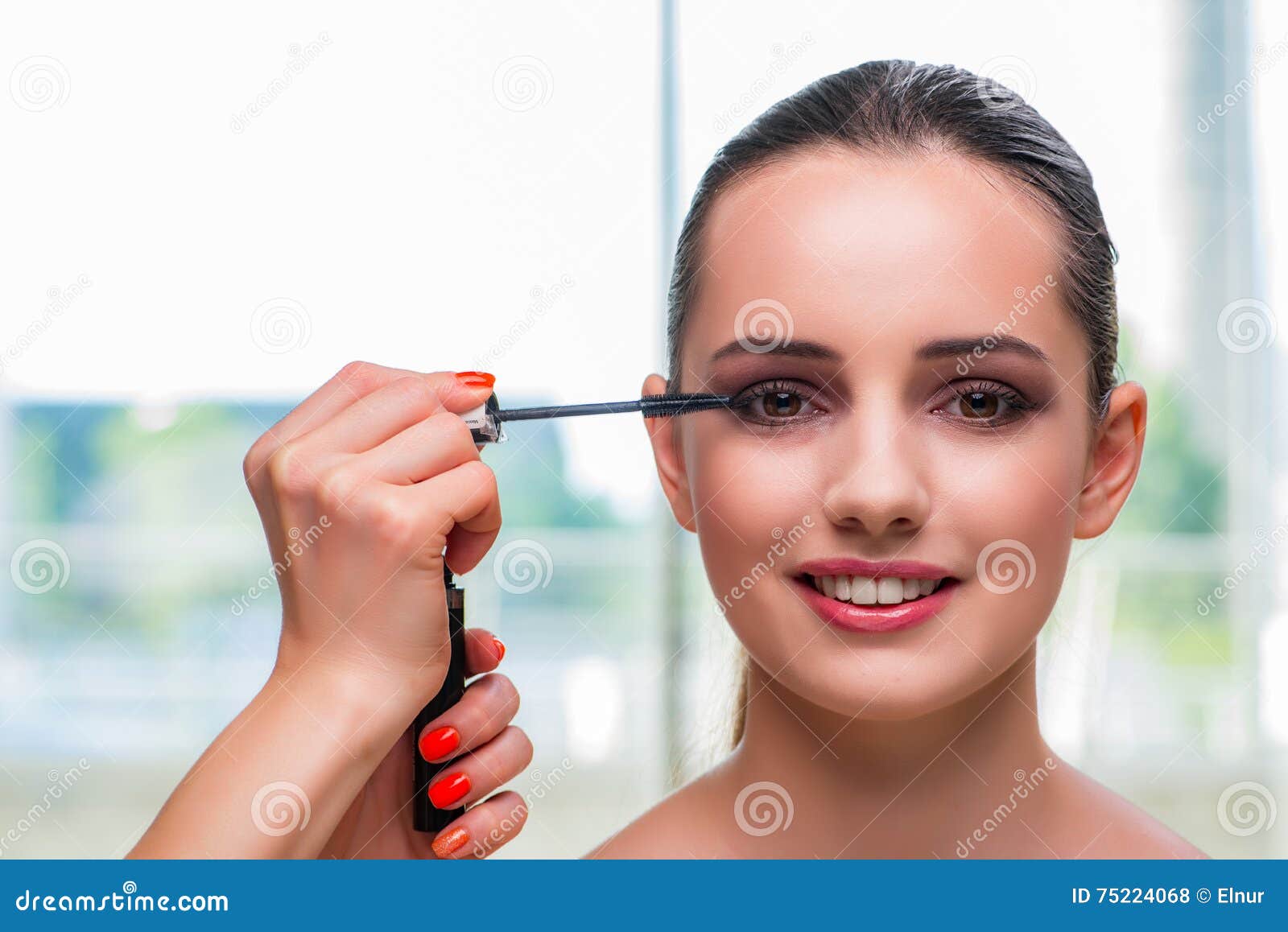 The Beautiful Woman during Make-up Cosmetics Session Stock Photo ...