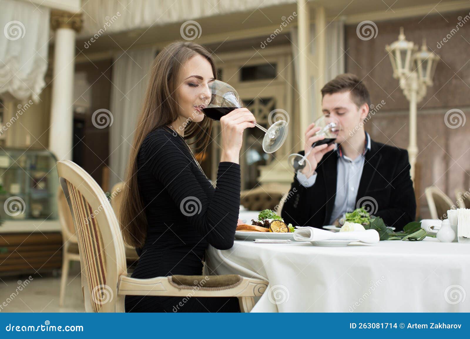 Beautiful Woman and Man Drinking Wine in Restaurant. Stock Photo ...