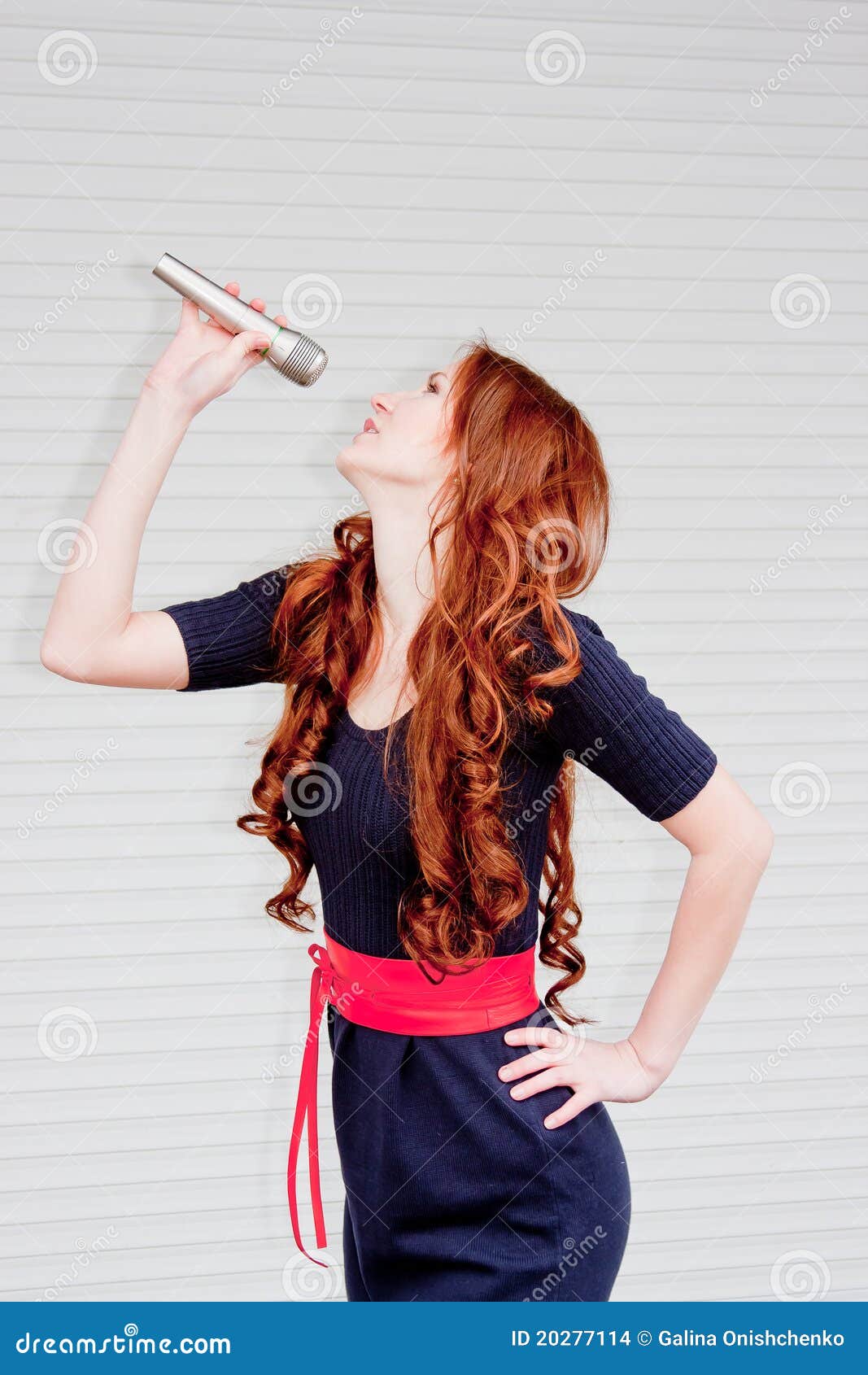 Beautiful Woman with a Microphone in Hands Stock Photo - Image of ...