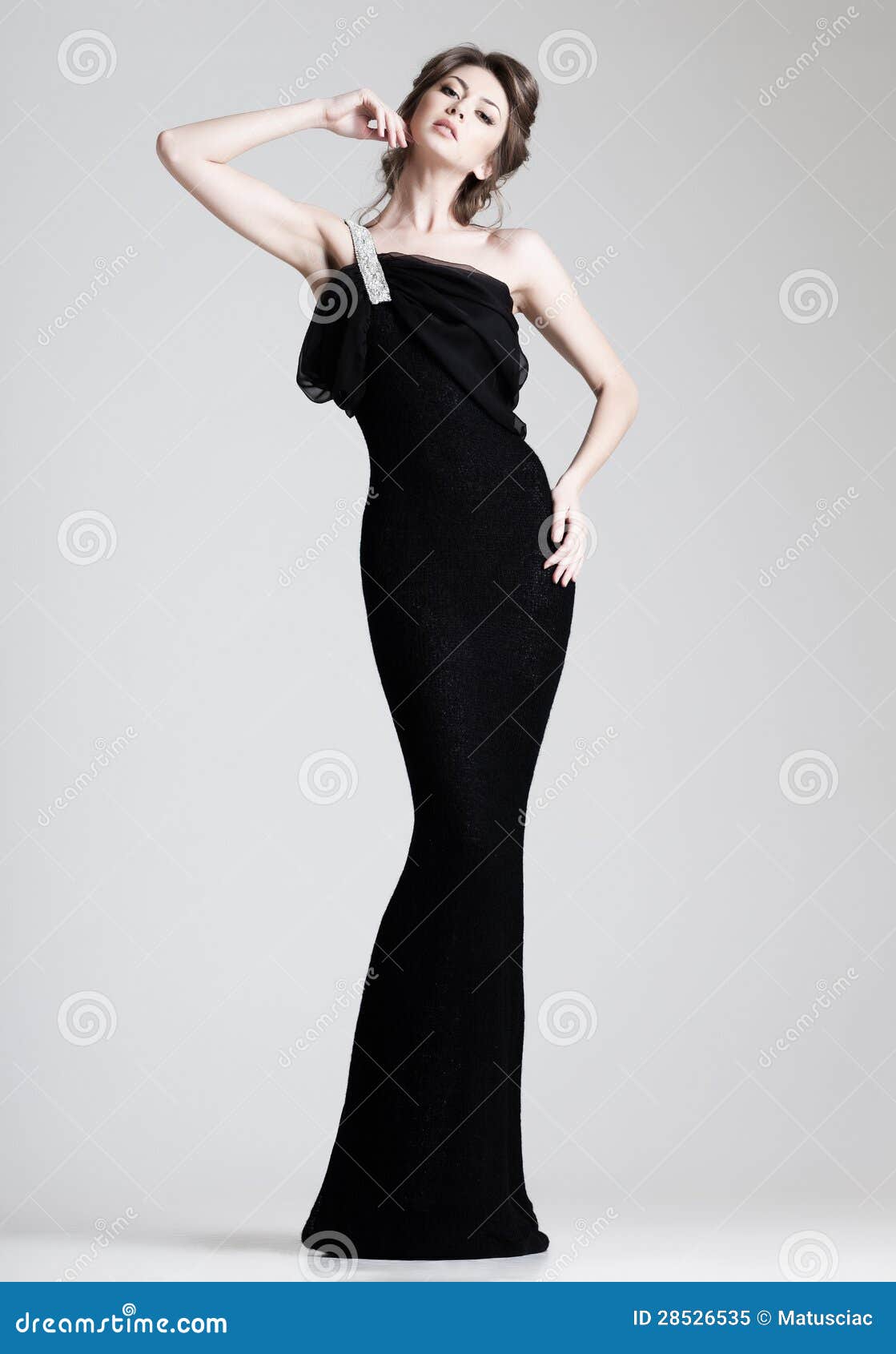 Beautiful Woman Model Posing in Elegant Dress in the Studio Stock Image ...