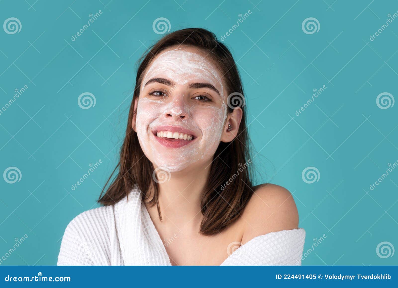 Beautiful Woman With Natural Makeup Applying Face Cream Stock Image