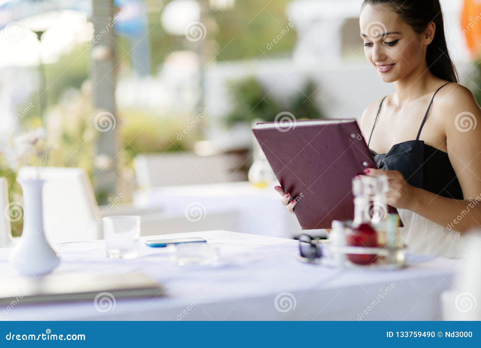 Beautiful Woman Ordering from Menu Stock Photo - Image of indoors ...