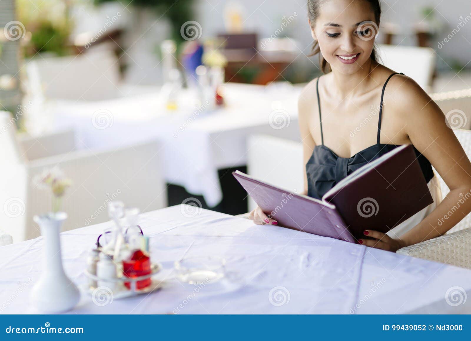 Beautiful Woman Ordering from Menu Stock Photo - Image of face ...