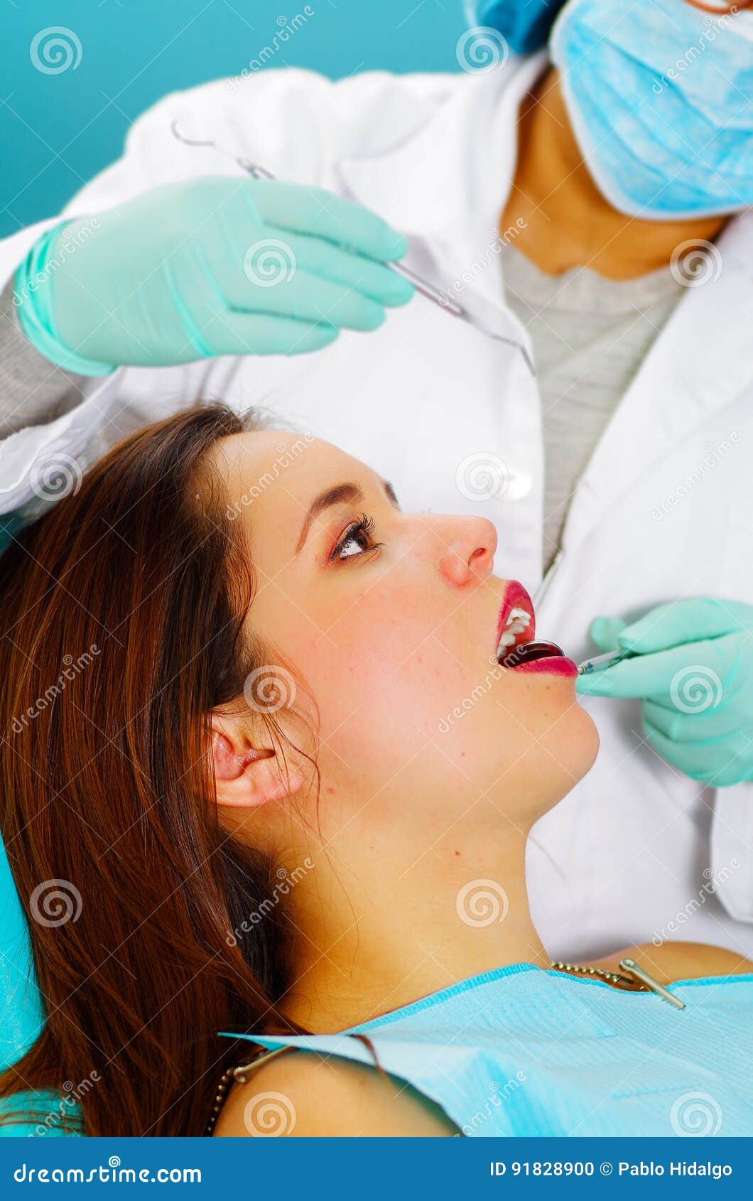 Beautiful Woman Patient Having Dental Treatment At Dentist`s Office