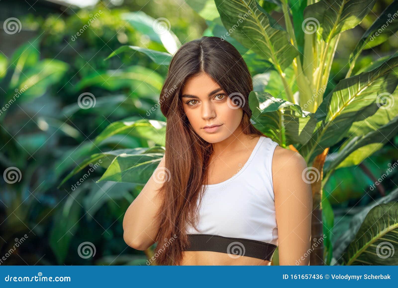 Beautiful Woman With Perfect Body Standing Up On The Beach Wearing