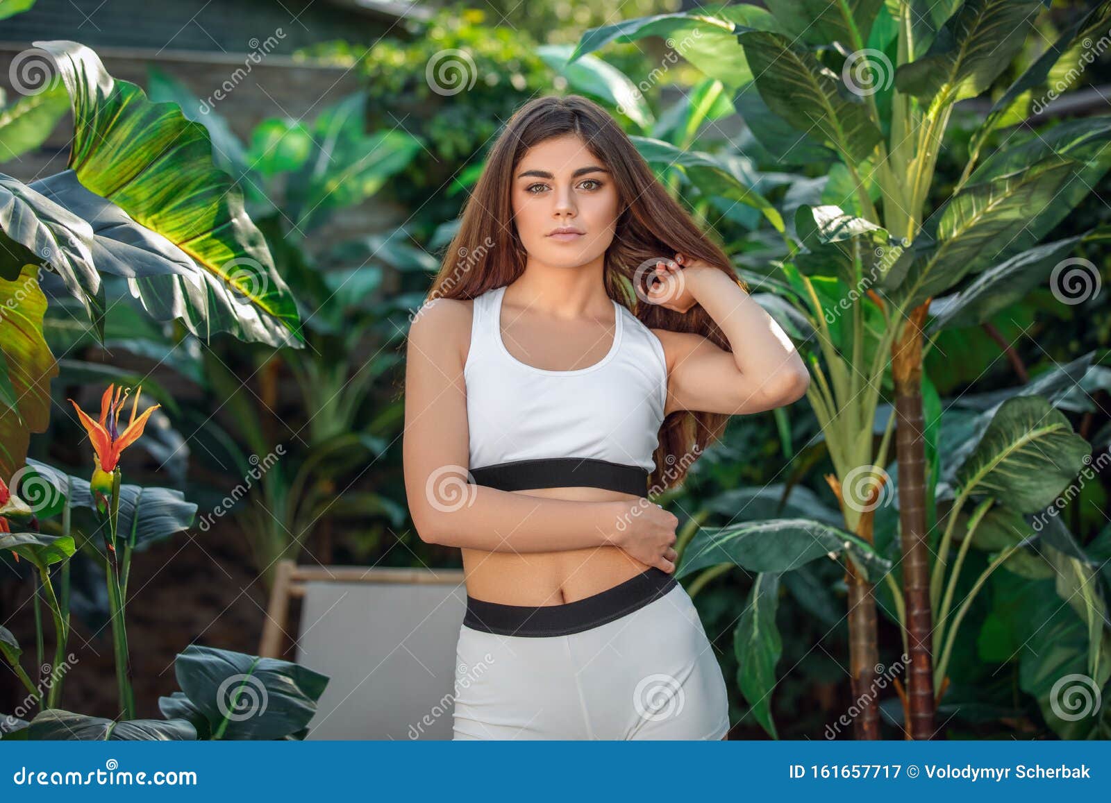 Beautiful Woman With Perfect Body Standing Up On The Beach Wearing