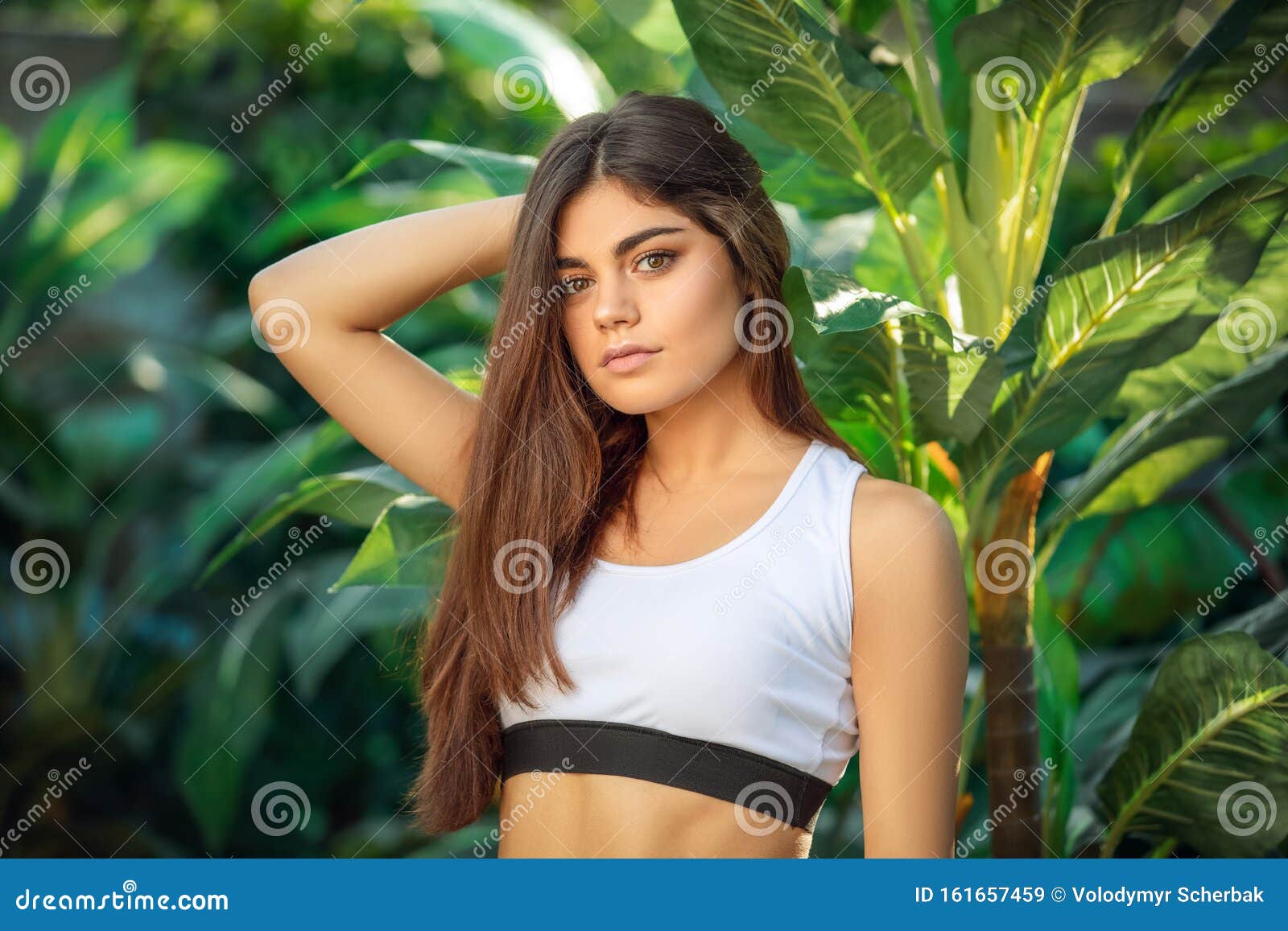 Beautiful Woman With Perfect Body Standing Up On The Beach Wearing