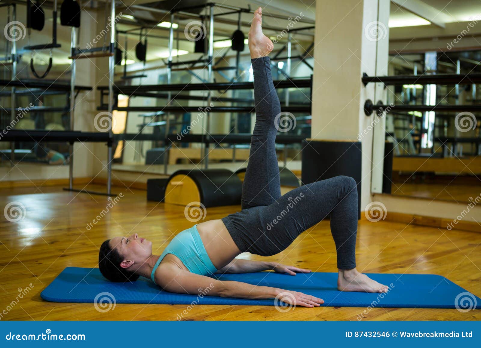Beautiful Woman Performing Stretching Exercise Stock Photo - Image of ...