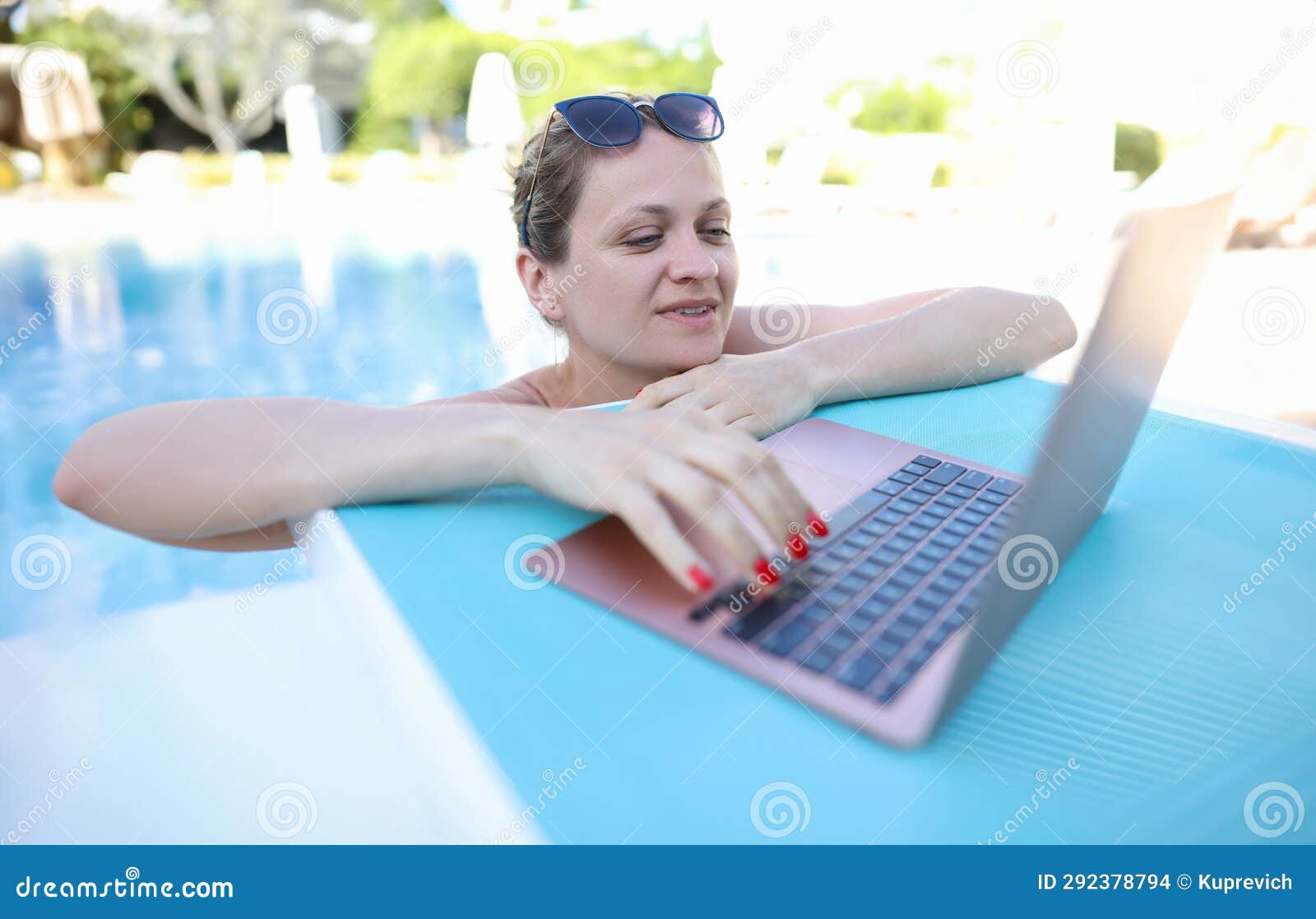 Beautiful Woman in Pool is Typing on Laptop Stock Photo - Image of ...