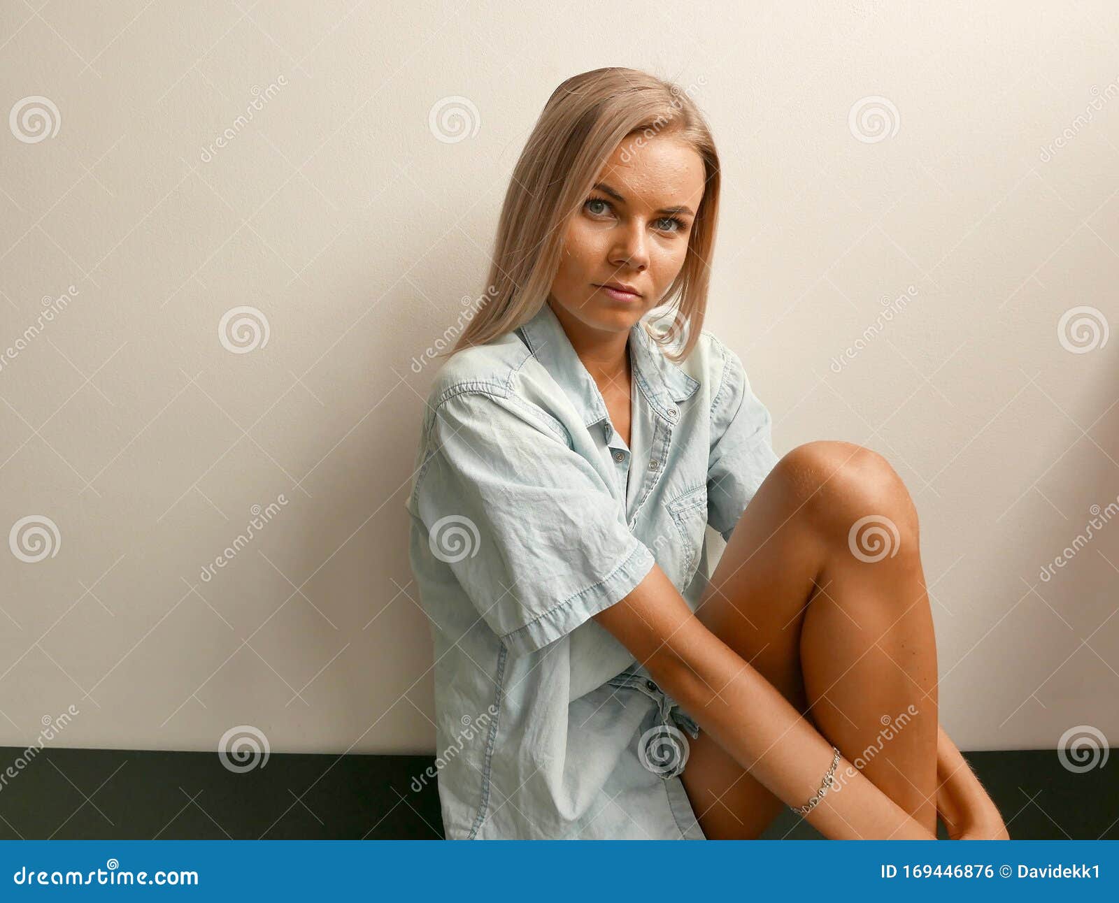 Beautiful Woman Portrait. Model Posing Sitting on Table Stock Photo ...