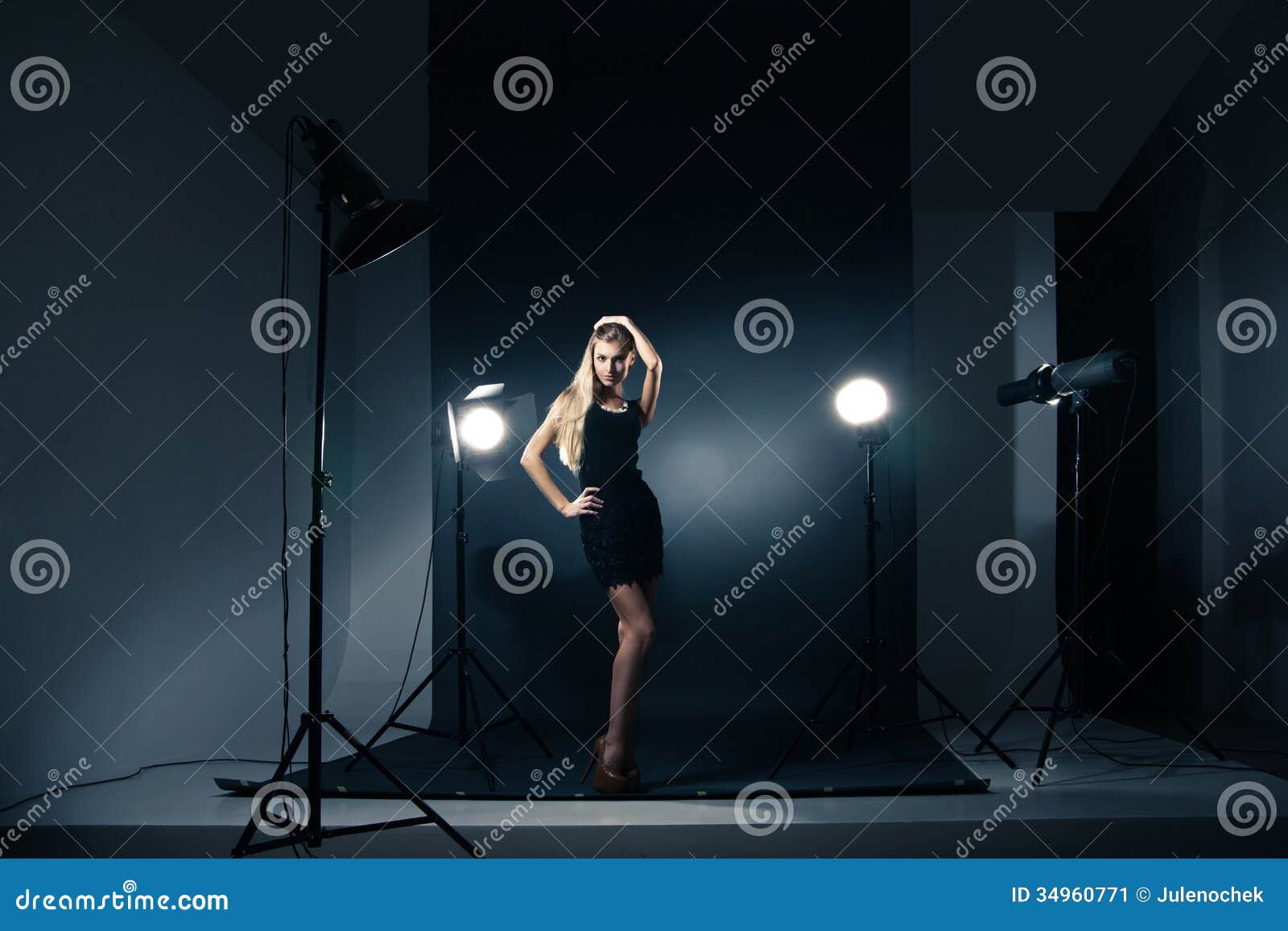 Beautiful Woman Posing at Studio in Light Flashes Stock Image - Image ...