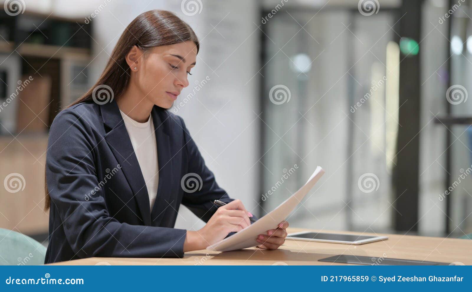 Beautiful Woman Reading Documents in Office Stock Image - Image of ...