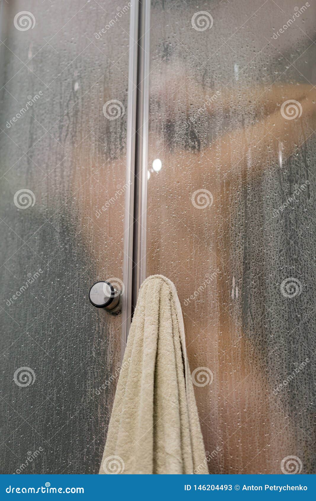 Beautiful Woman In The Shower Behind Glass With Drops Woman In The