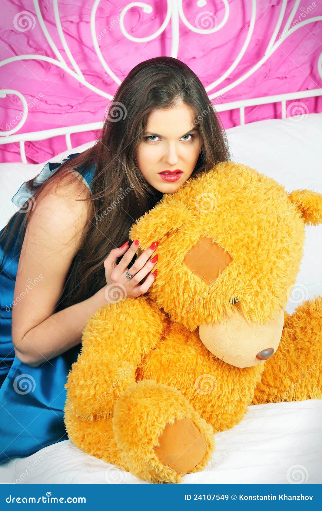 Beautiful Woman Sitting on a Bed with Teddy Bear Stock Image - Image of ...
