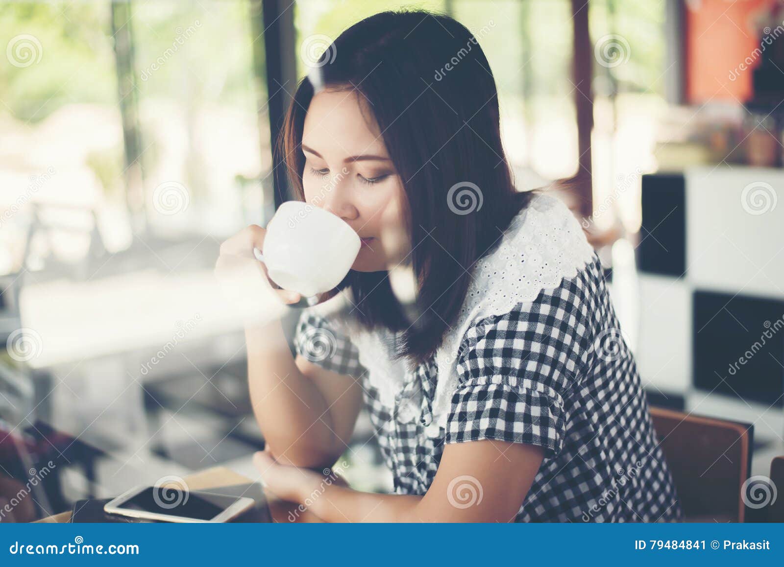 Beautiful Woman Sitting and Drinking Coffee at Cafe. Stock Image ...