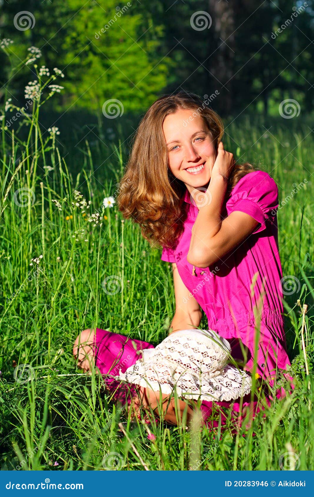 Beautiful Woman Sitting in Grass and Laughs Stock Photo - Image of ...