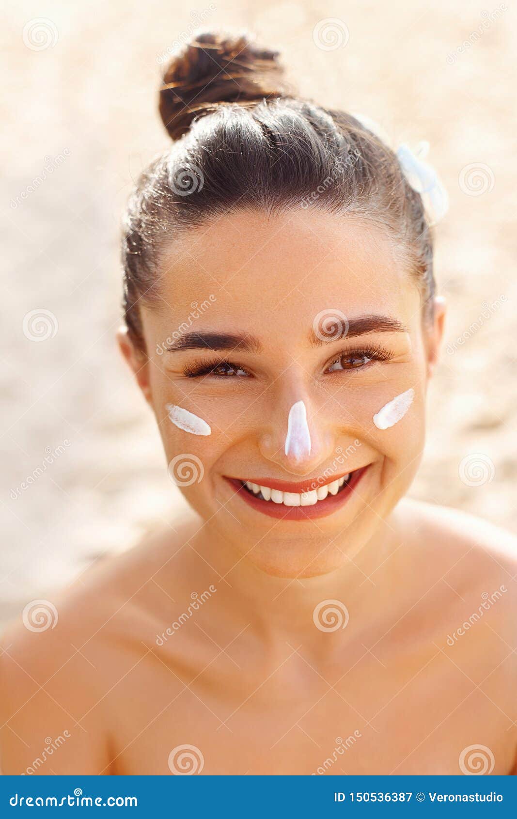 Beautiful Woman Smile Applying Sun Cream On Face Skin And Body Care