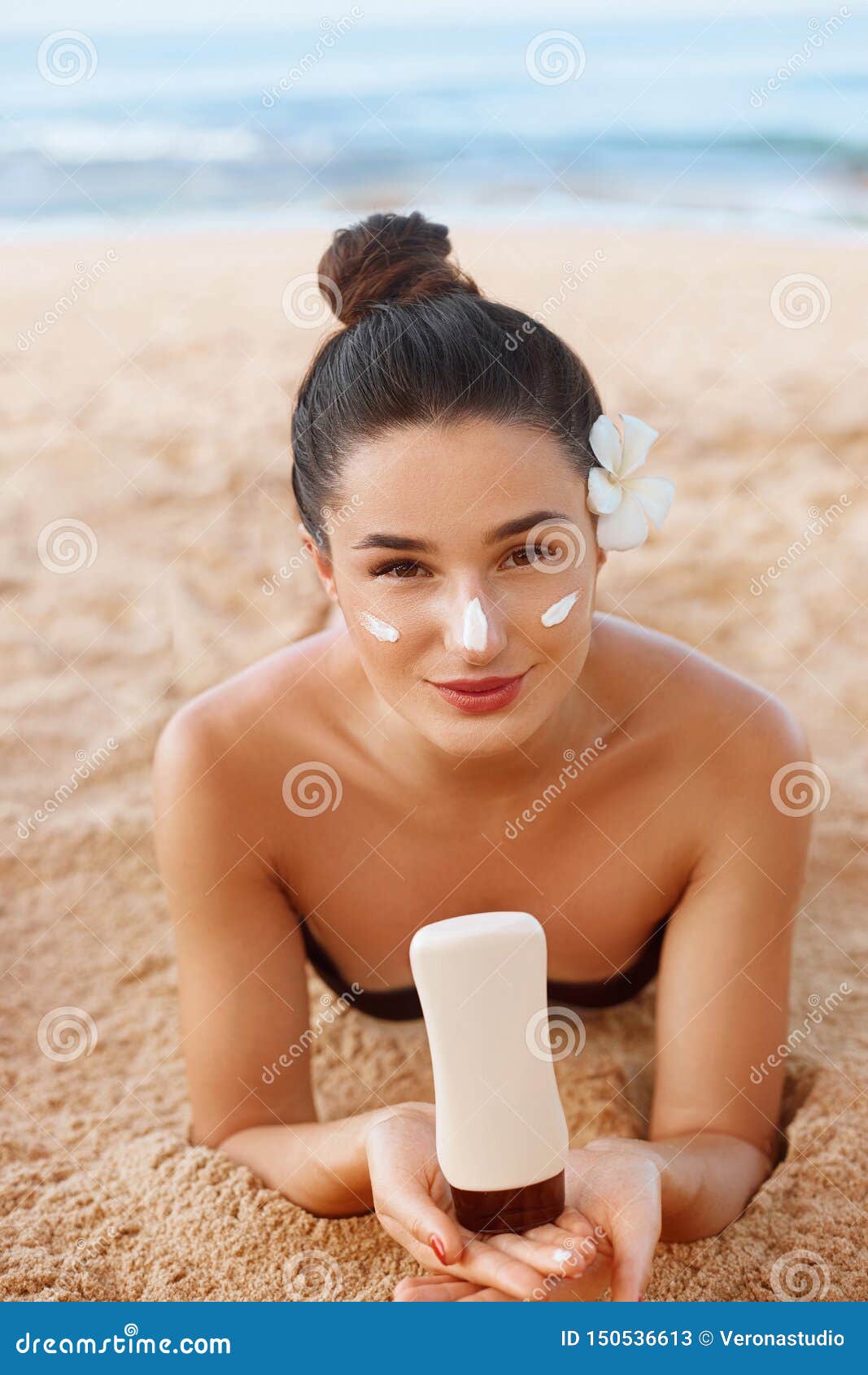 Beautiful Woman Smile Applying Sun Cream On Face Skin And Body Care