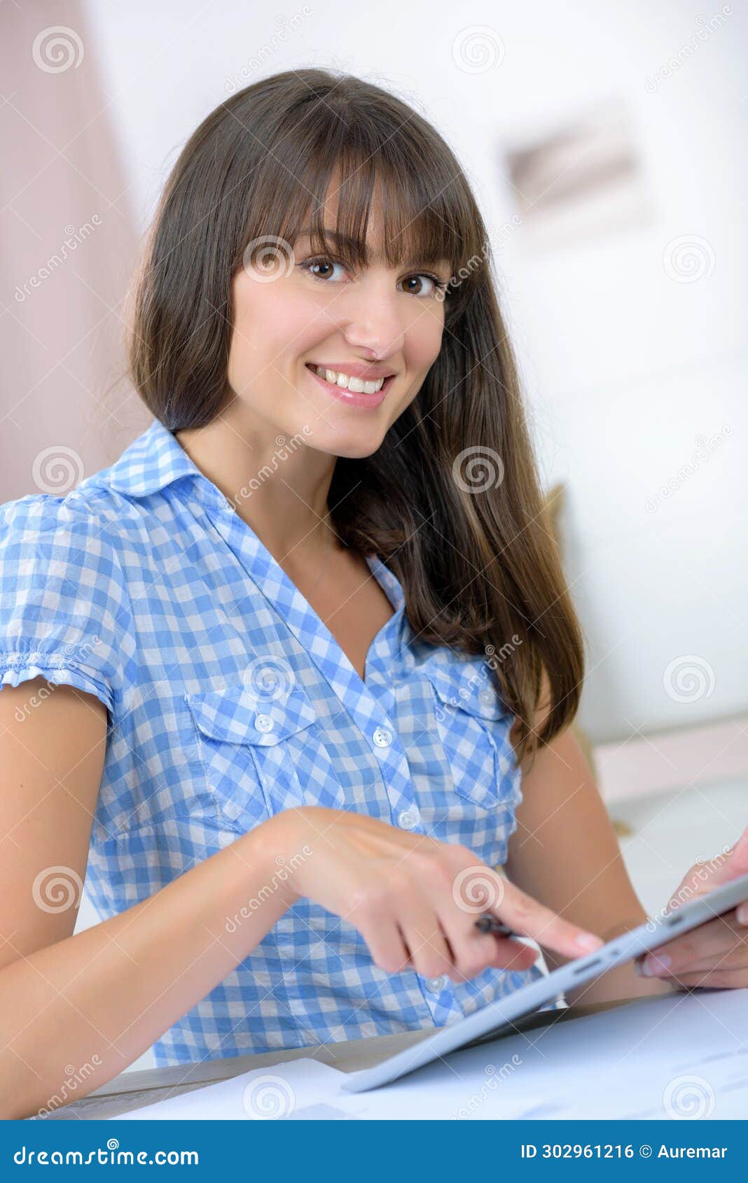 Beautiful Woman Smiling while Using Tablet Computer Stock Photo - Image ...