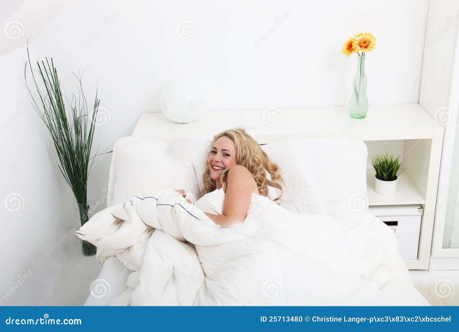 Beautiful Woman Snuggling Down in Bed Stock Photo - Image of ...
