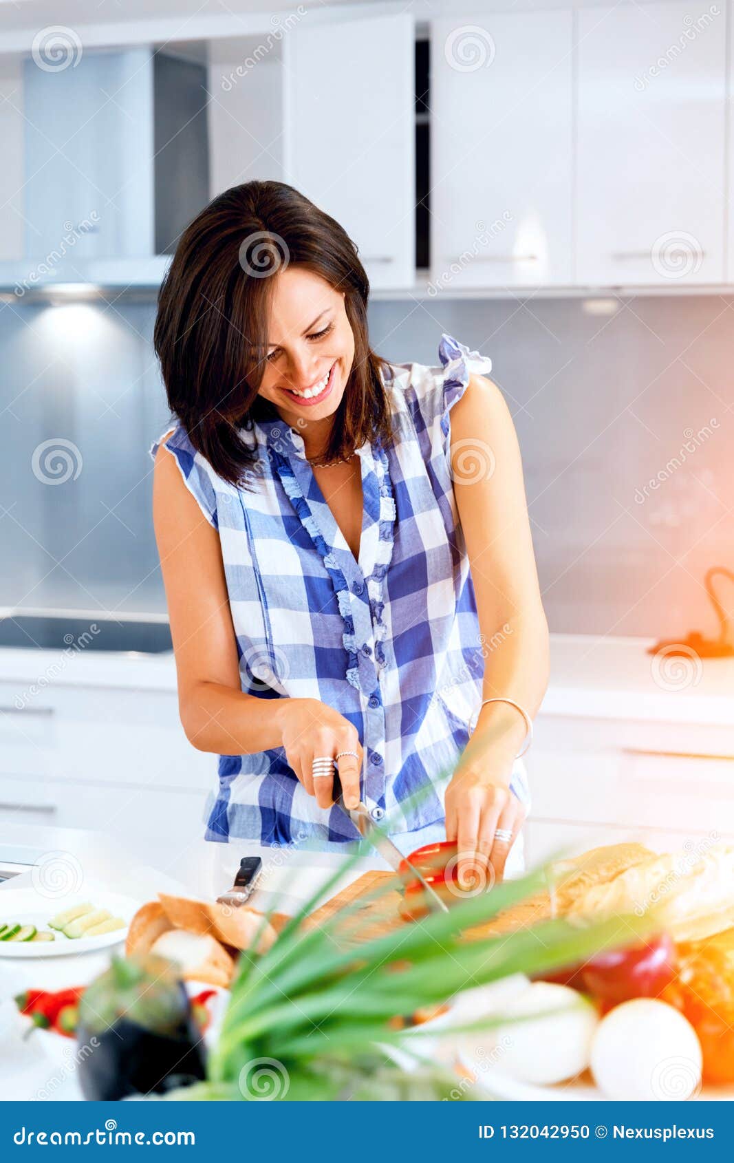 Beautiful Woman Standing in the Kitchen and Smiling Stock Photo - Image ...