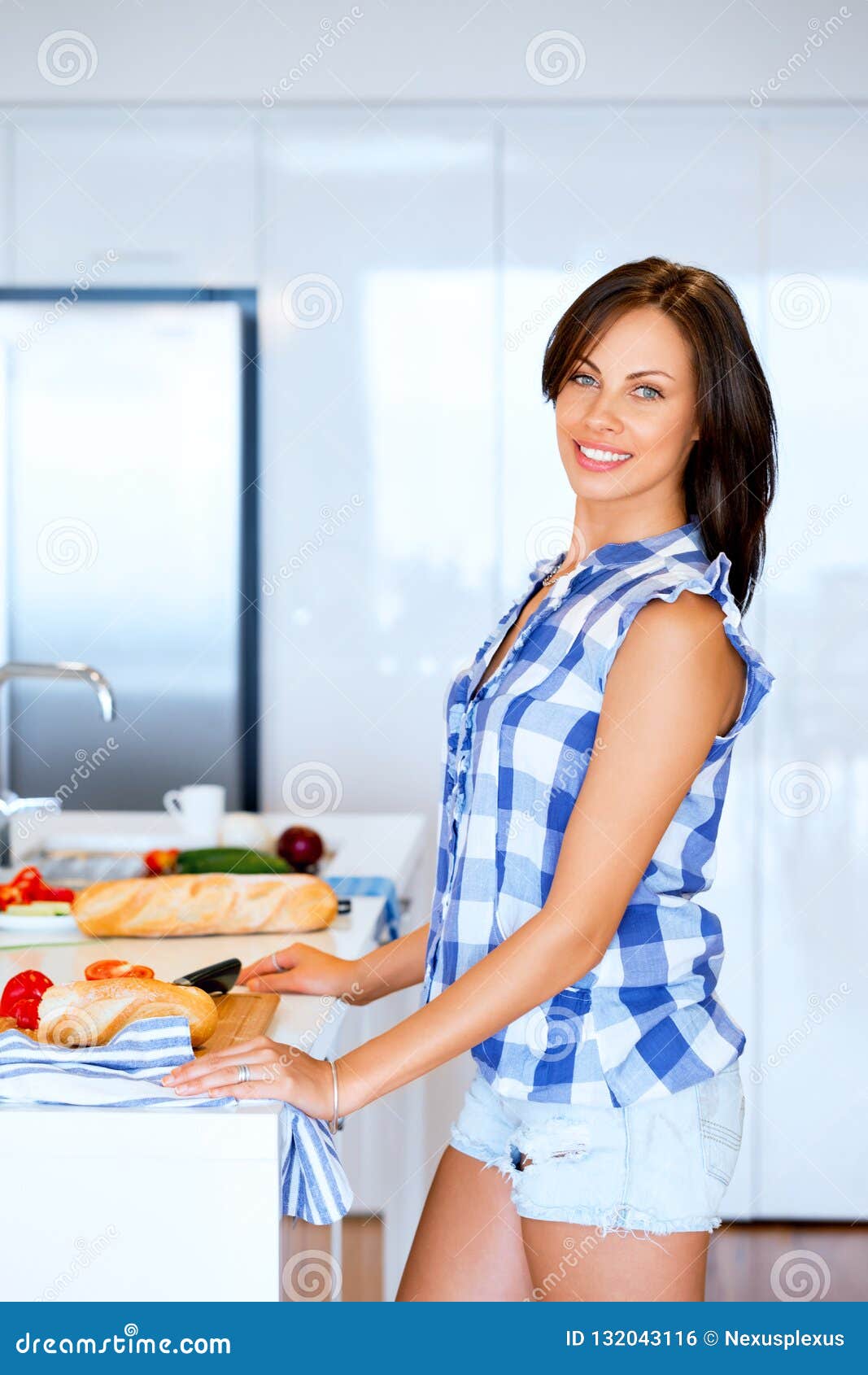 Beautiful Woman Standing in the Kitchen and Smiling Stock Photo - Image ...