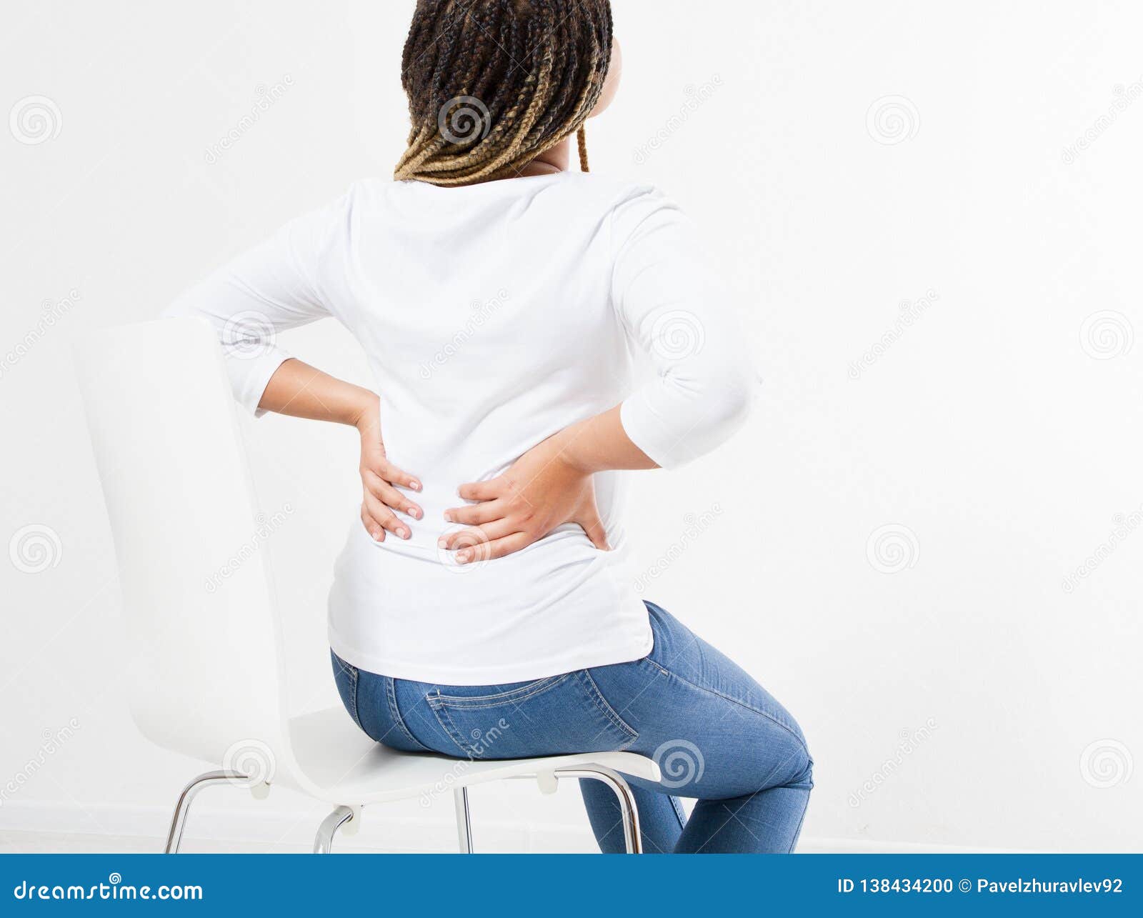 Beautiful Woman Suffering from Backache on Chair - Back View Stock ...