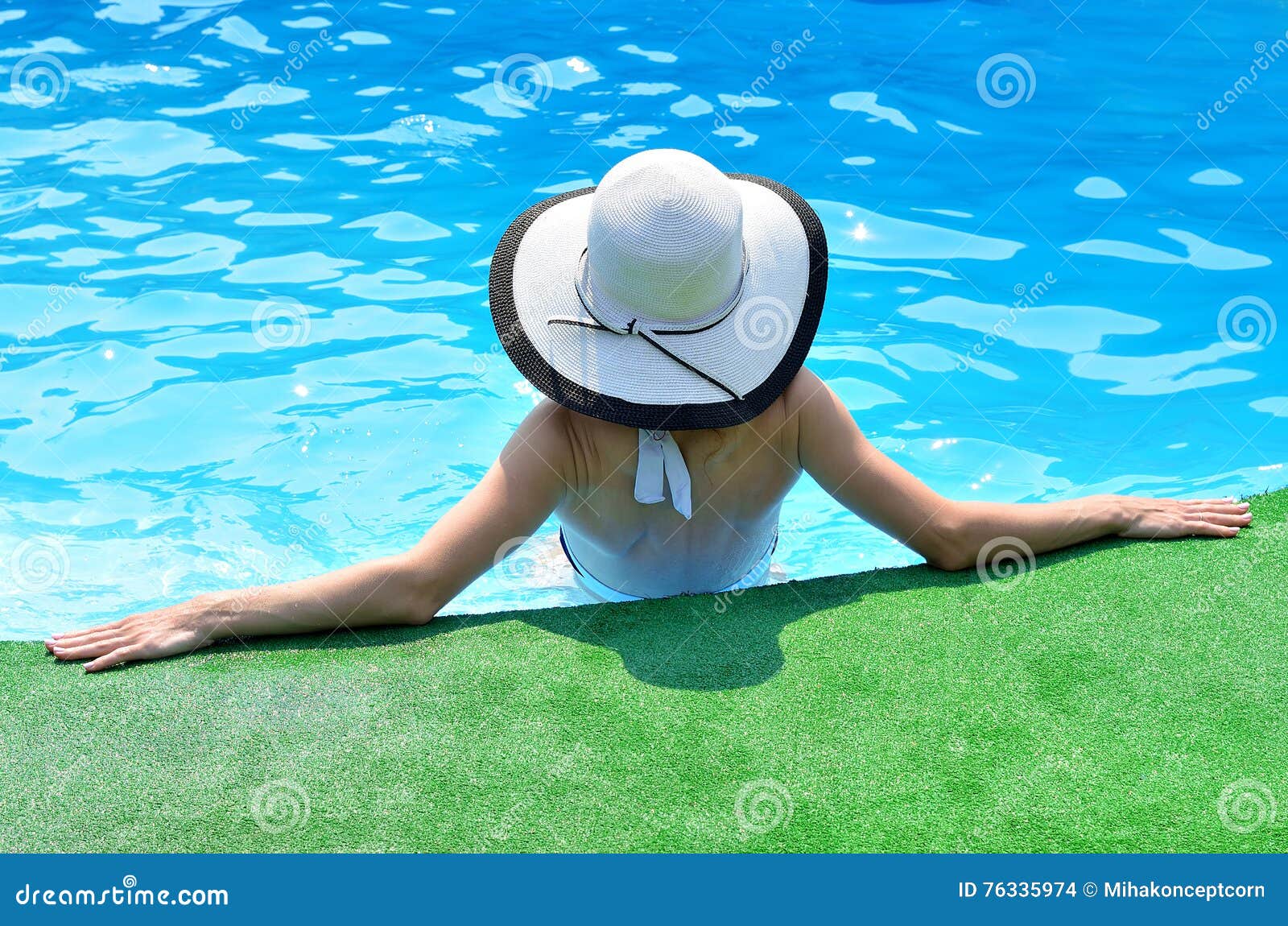 Beautiful Woman Sunbathing by the Pool, Top View. Stock Photo - Image ...