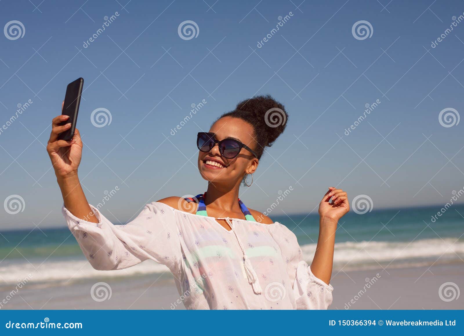 Beautiful Woman Taking Selfie With Mobile Phone At Beach In The