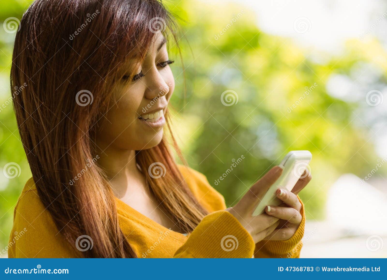 Beautiful Woman Text Messaging in Park Stock Image - Image of female ...