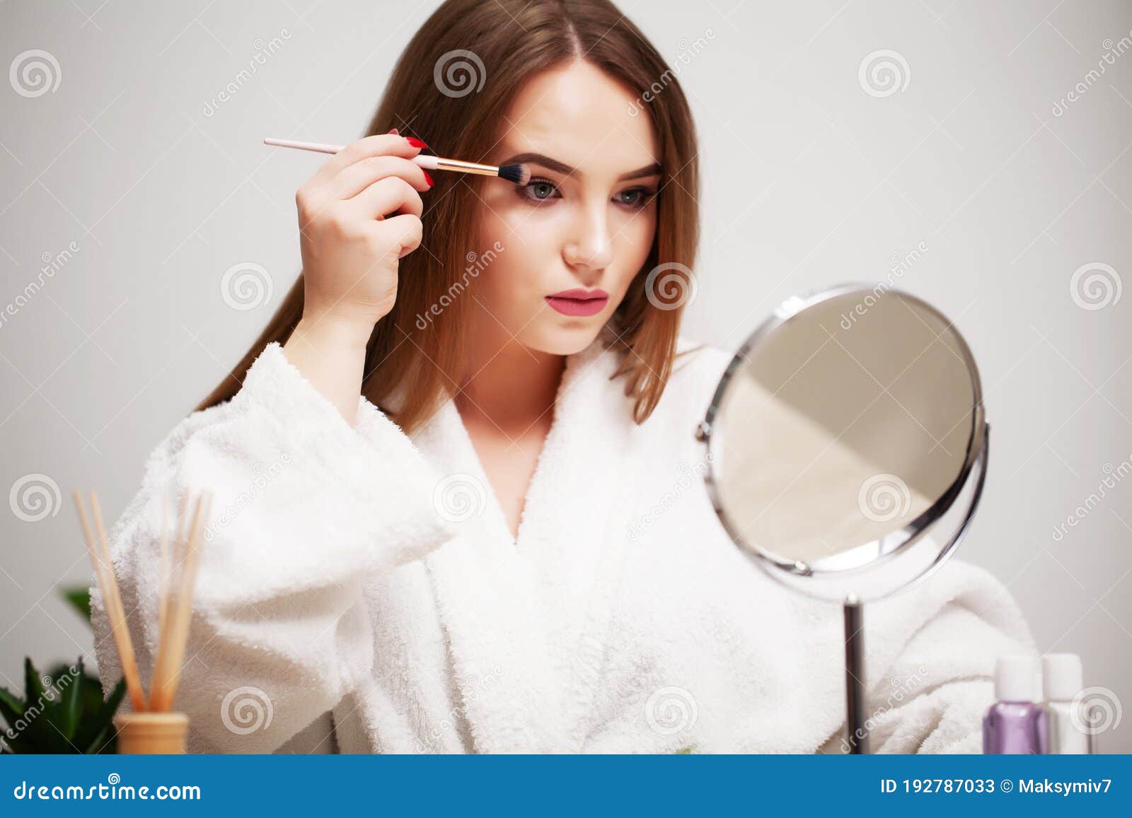 Beautiful Woman Using Brush for daily Makeup in Bathroom Stock Image ...
