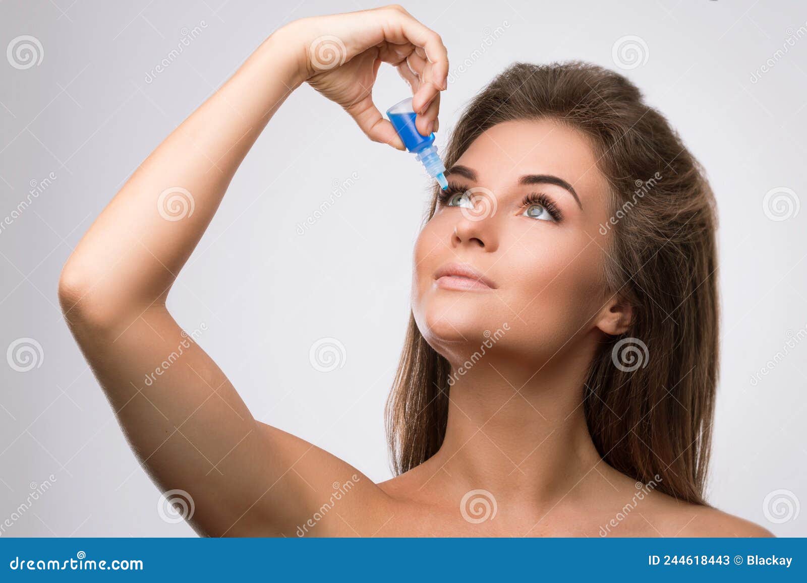 Studio Shot of Beautiful Woman Using Eye Drops Stock Image - Image of ...