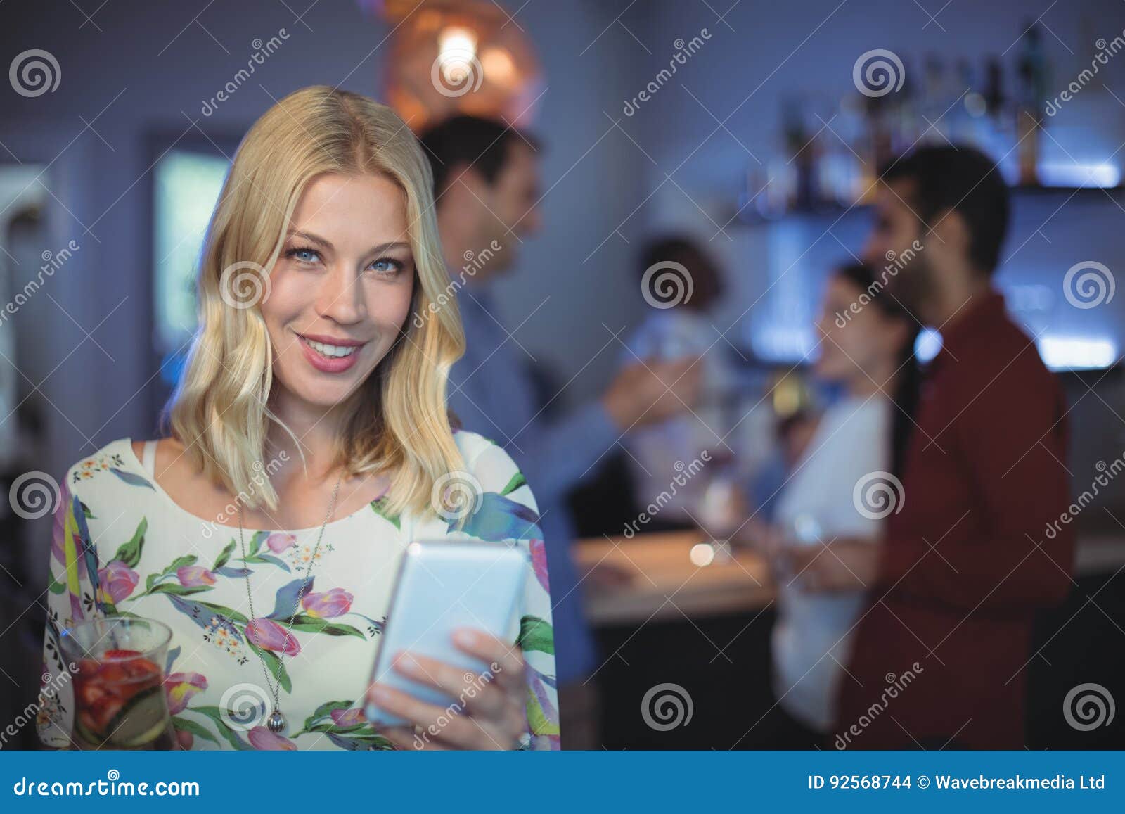 Beautiful Woman Using Mobile Phone at Bar Restaurant Stock Photo ...