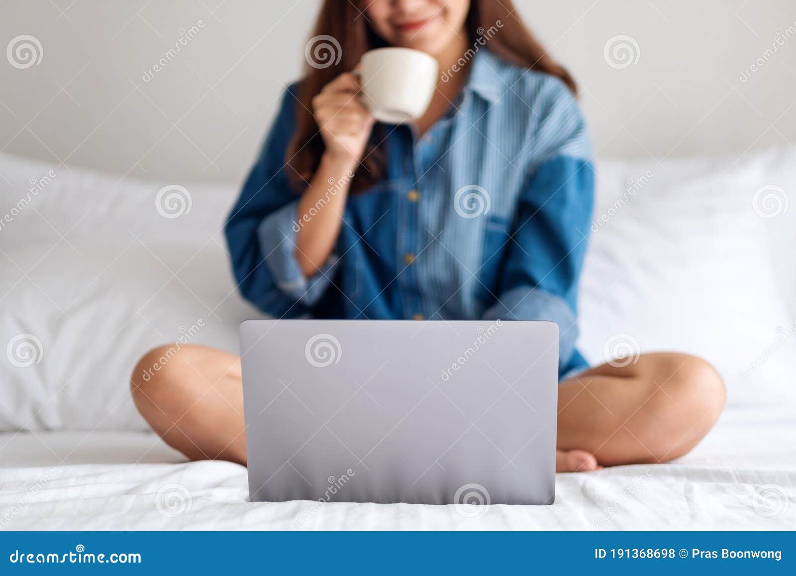 A Beautiful Woman Using and Working on Laptop Computer , Drinking ...