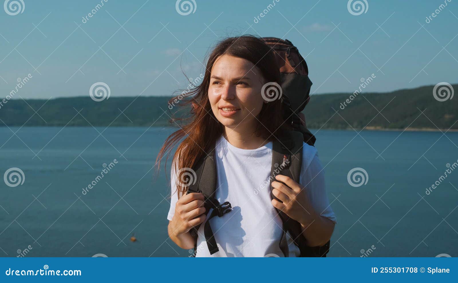 The Beautiful Woman Walking with Backpack Along the Coast. Stock Photo ...