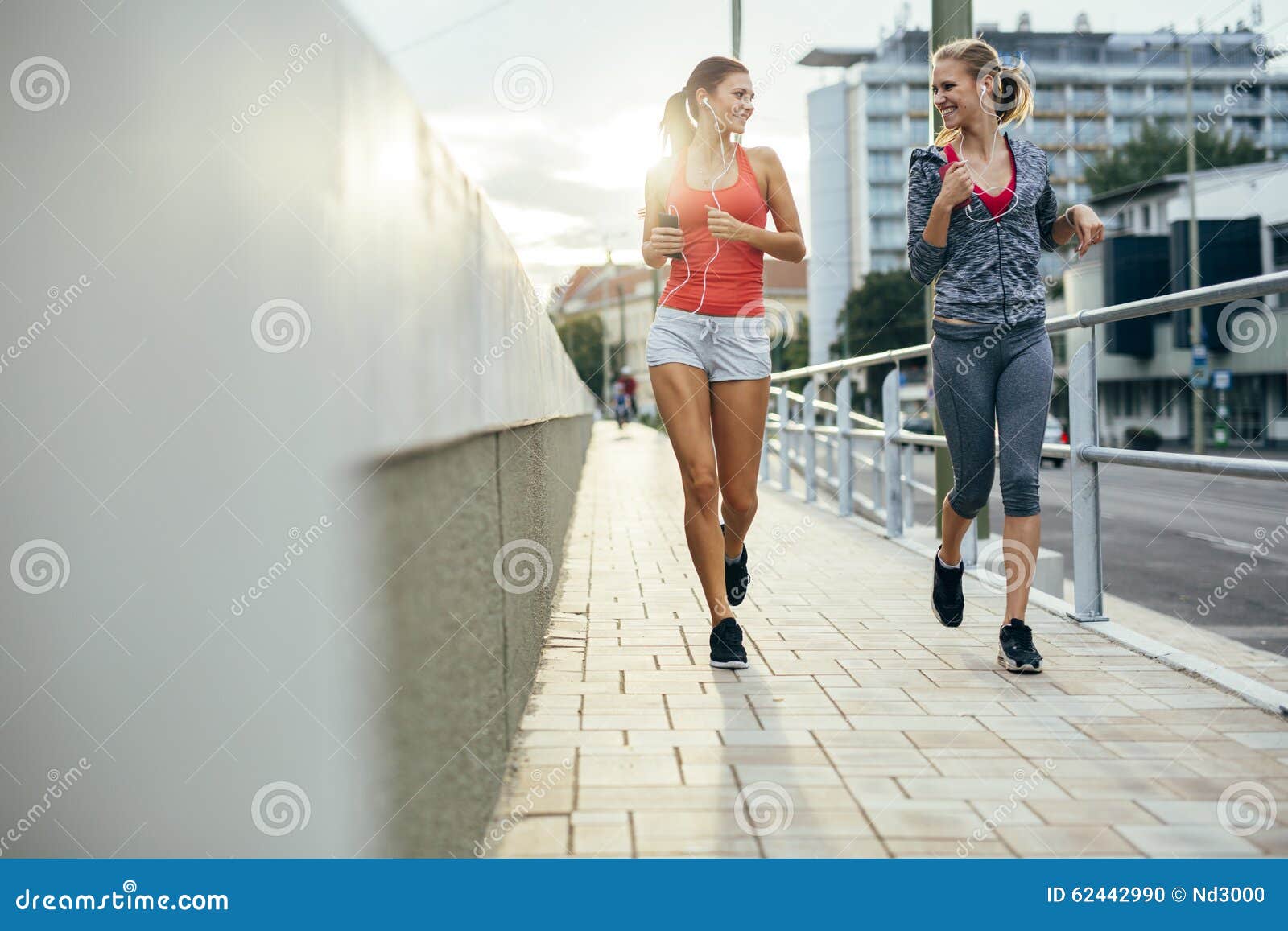 Beautiful Women Jogging in Sunset Stock Photo - Image of flare, person ...