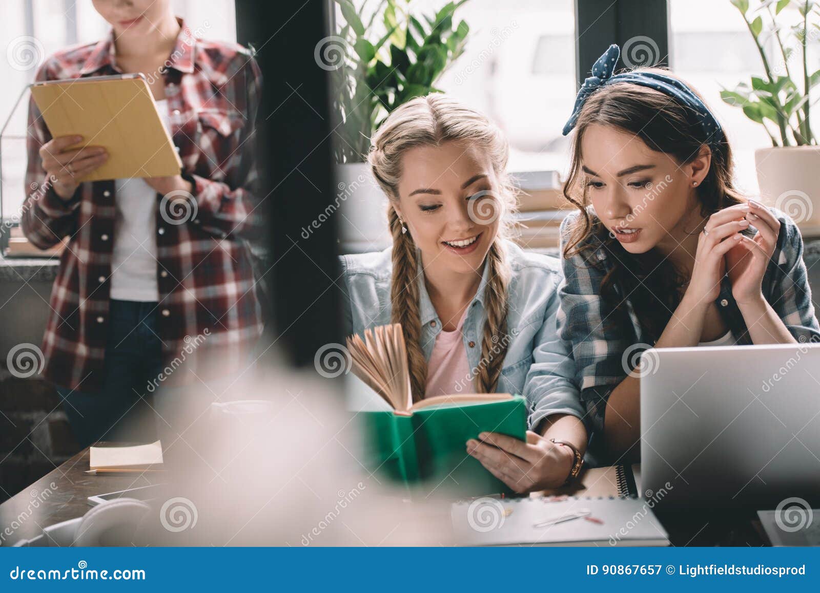 Beautiful Women Students Studying with Devices and Book Stock Image ...