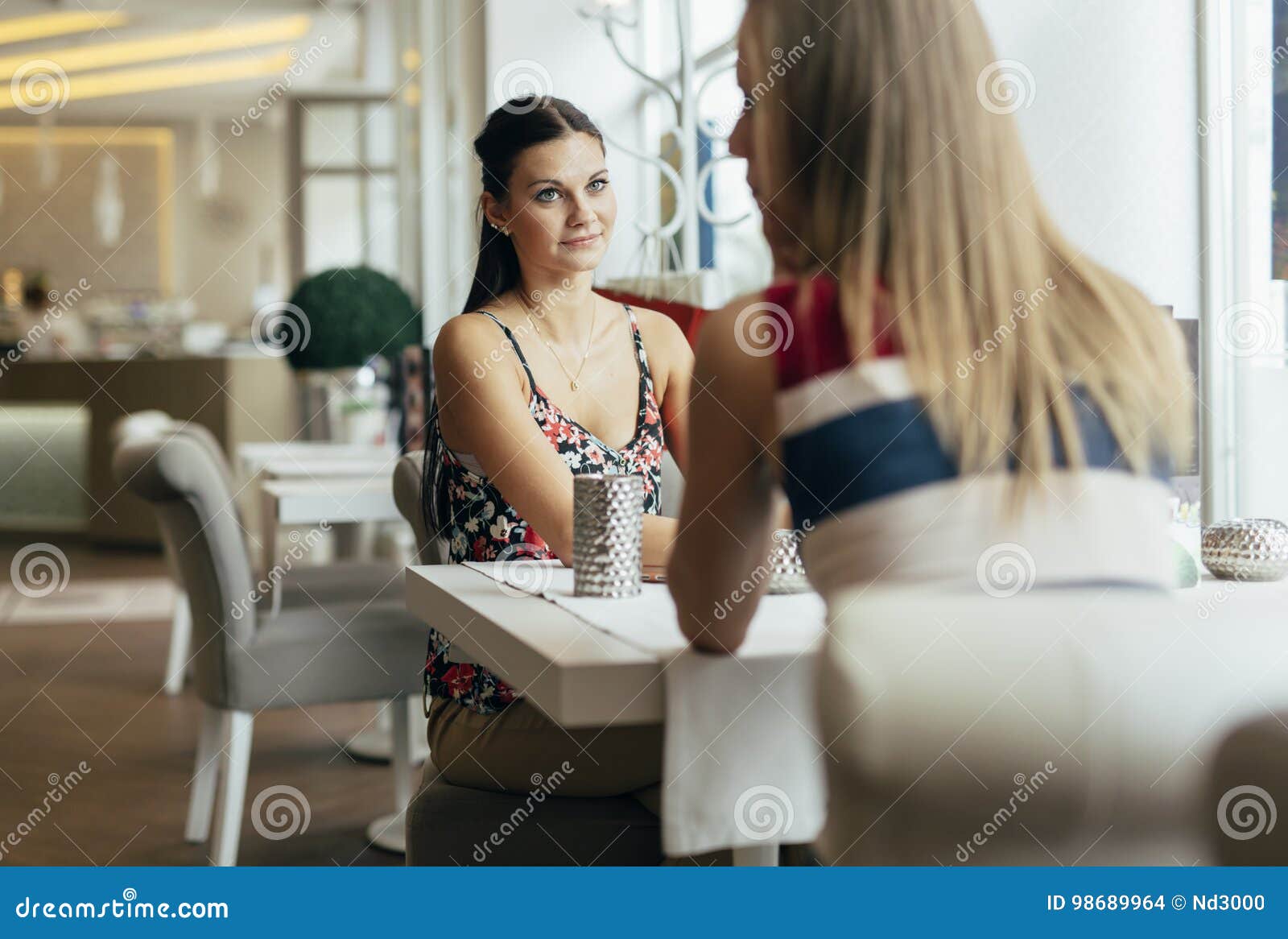 Beautiful Women Talking in Restaurant Stock Photo - Image of people ...