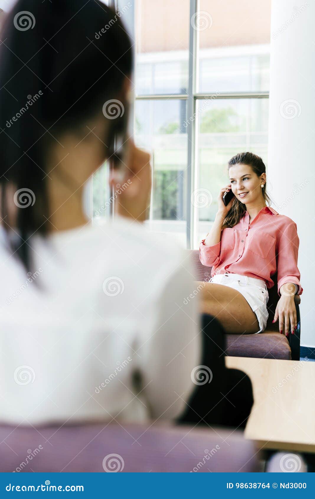 Beautiful Women Using Phones and Talkin during Break Stock Photo ...