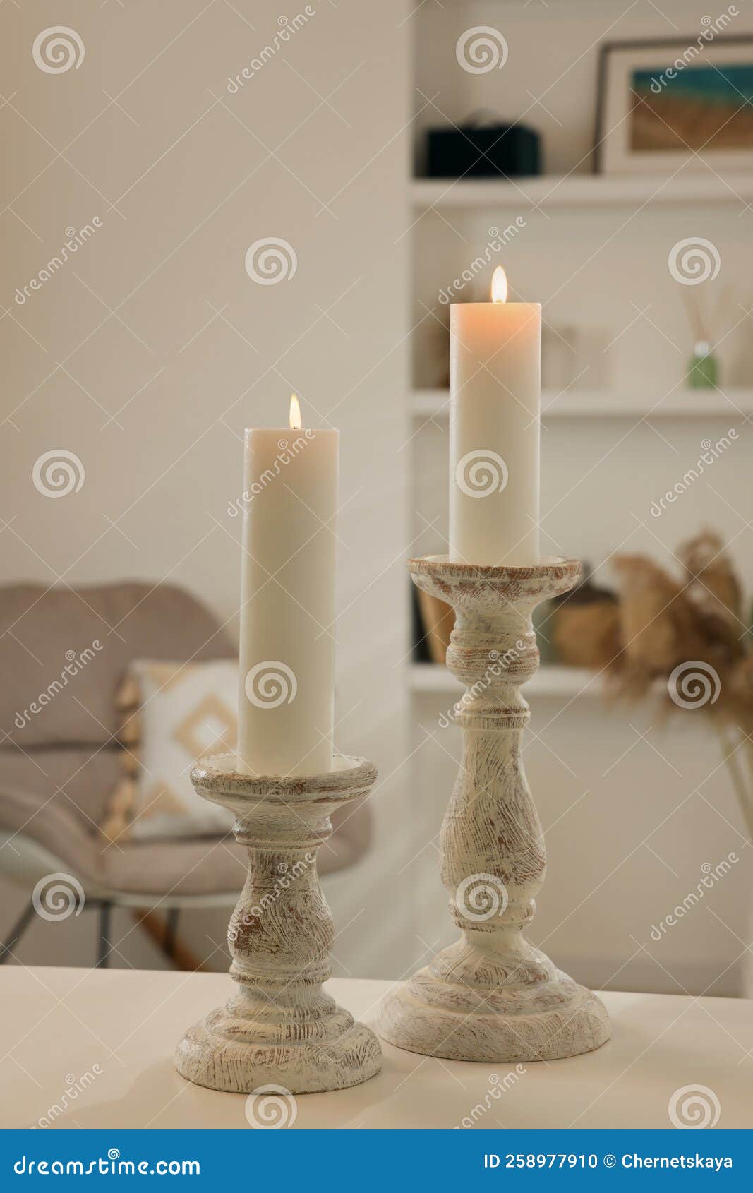 Beautiful Wooden Candlesticks on White Table in Room Stock Photo ...