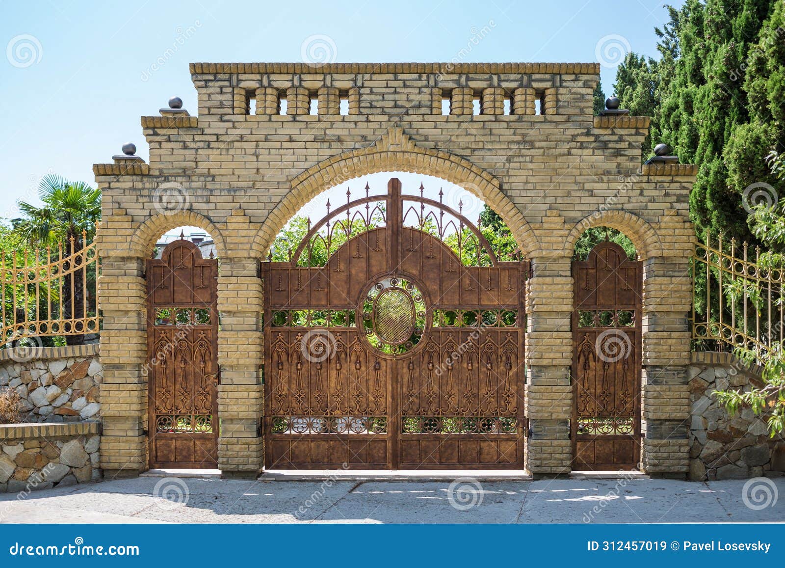 Beautiful Wrought-iron Gates In Brick Arch On The Royalty-Free Stock ...
