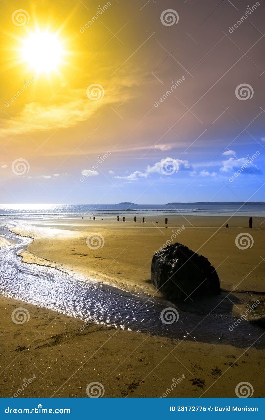 Beautiful Yellow Sun Over the Youghal Beach Stock Photo - Image of blue ...