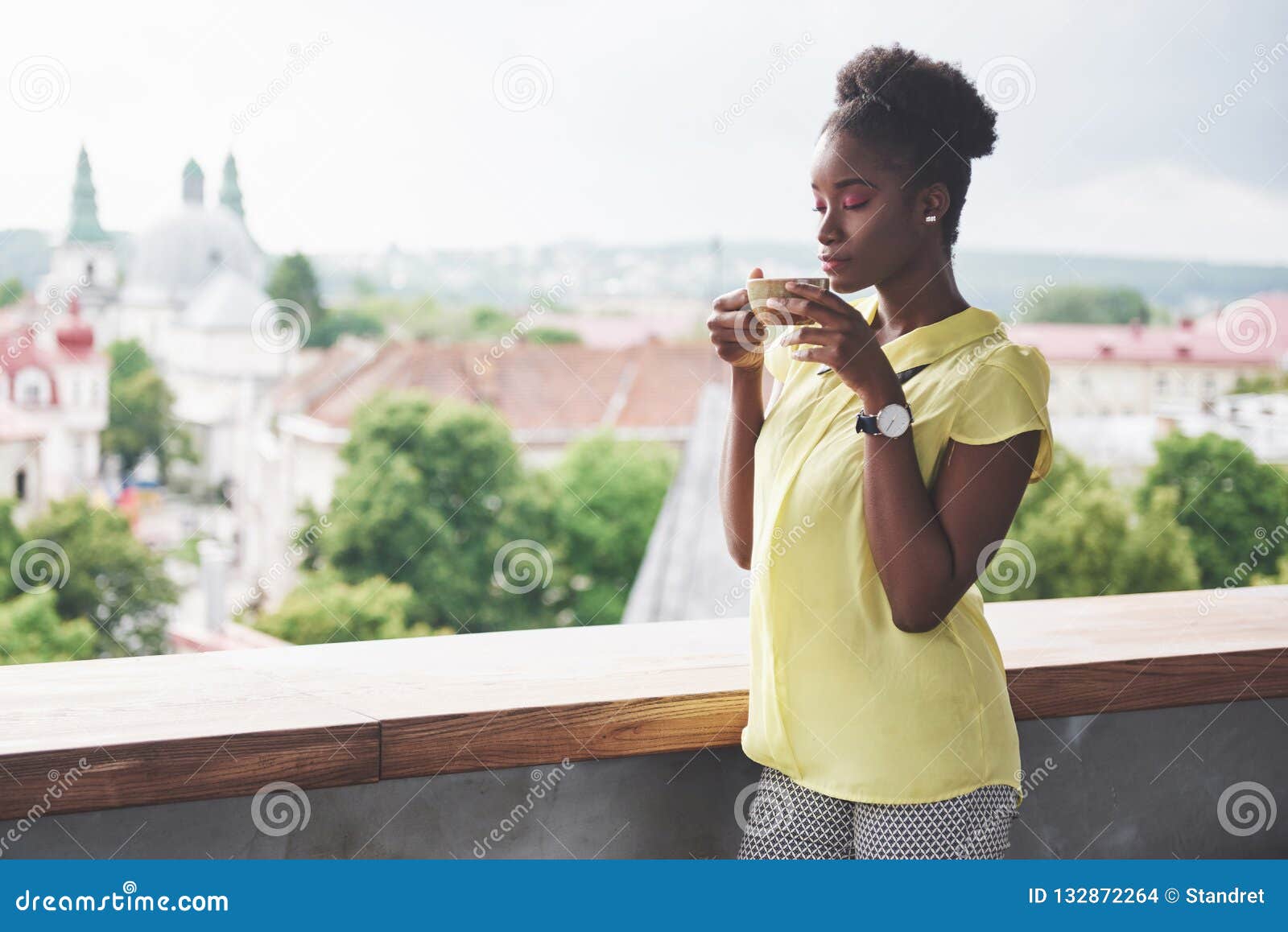 Beautiful Young African American Business Woman Drinking Coffee At A